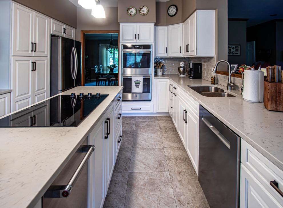 White Kitchen with Carrara Grigio Quartz Countertops and Subway Tile ...