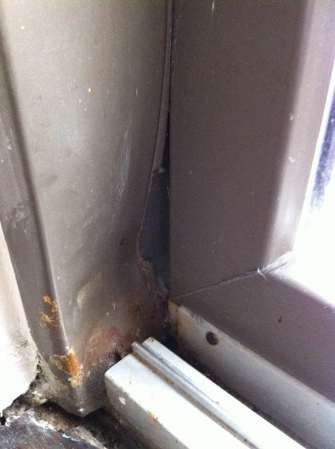 How can I repair rotted wood in vinyl clad door?