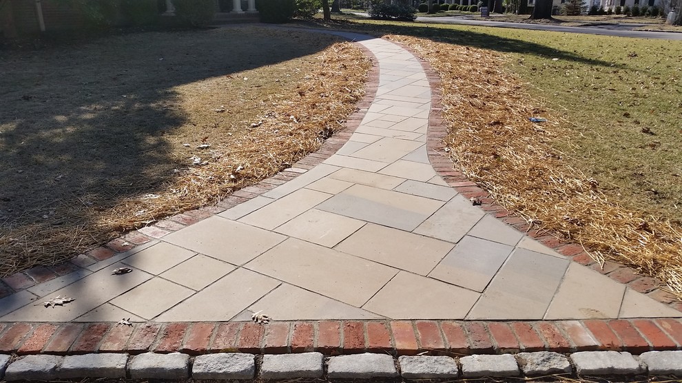 Custom cut flagstone with brick band.