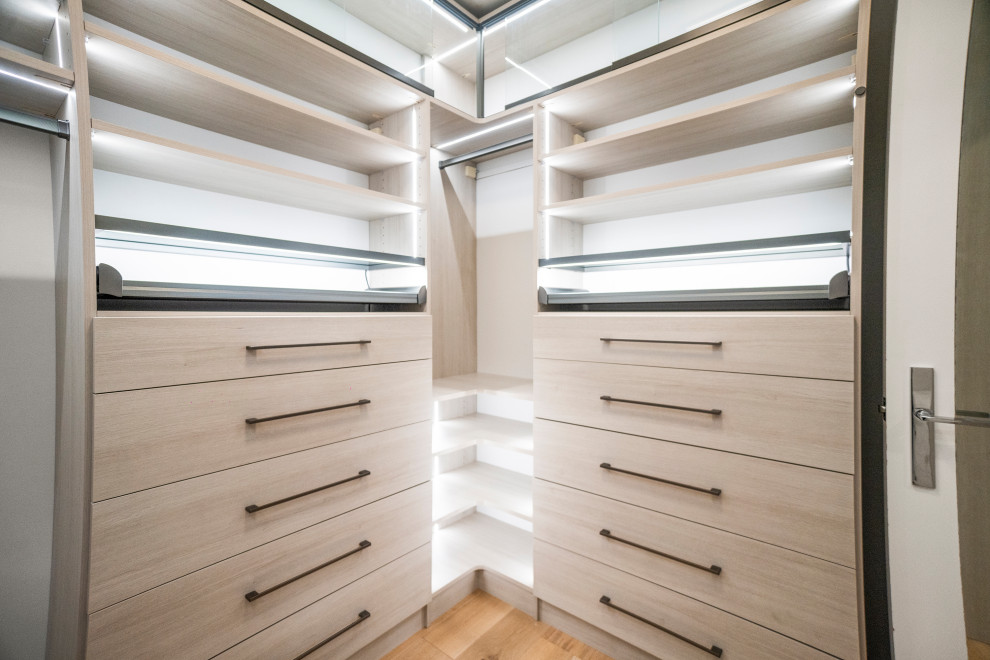 Luxurious Walk-In closet with LED lighting and glass sliding doors ...