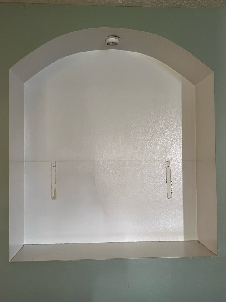 Need ideas to update arched alcove shelving for lil living room