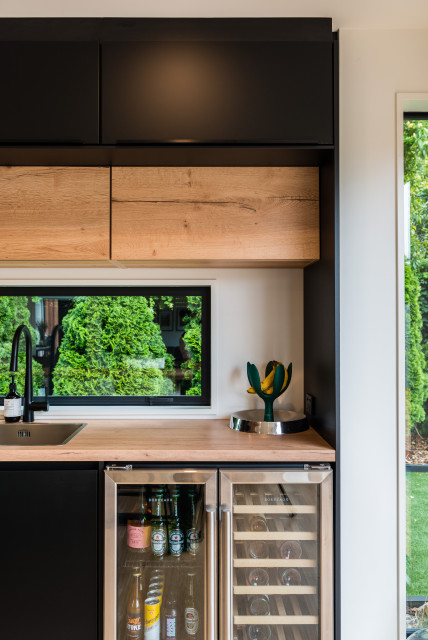 Stunning Black and Wood-Look entertainers kitchen - Contemporary ...