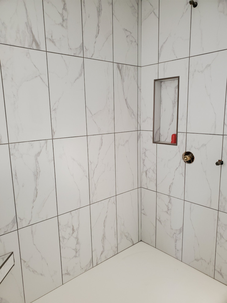Where should the seam be in a tile shower?