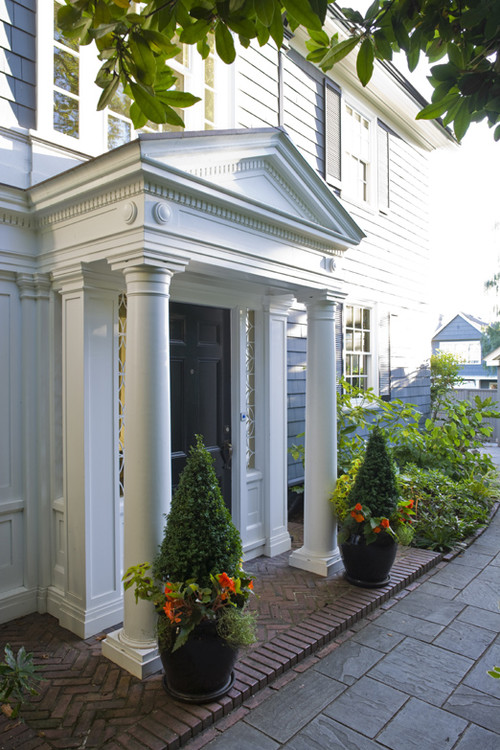 Portico design for a brick colonial.