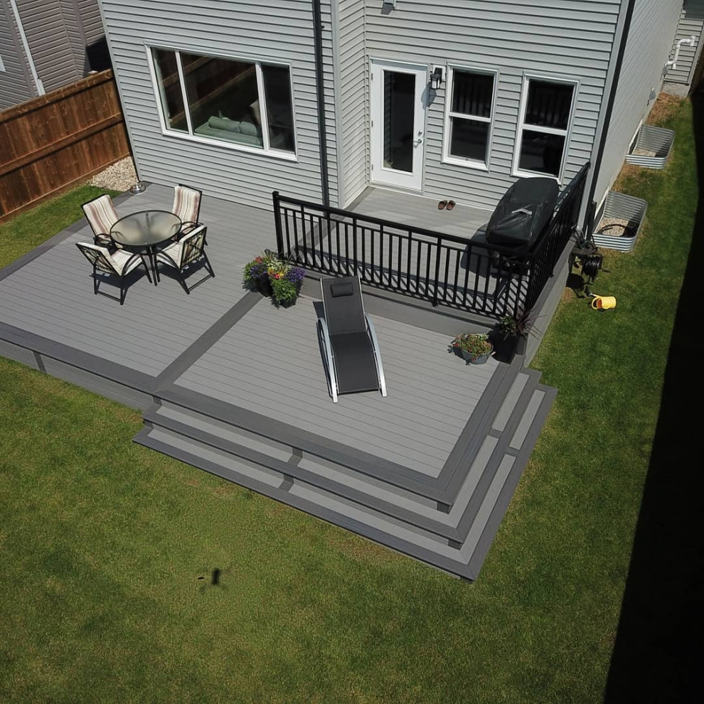 Custom 2 level Fiberon deck with welded railing and wrap around stairs ...