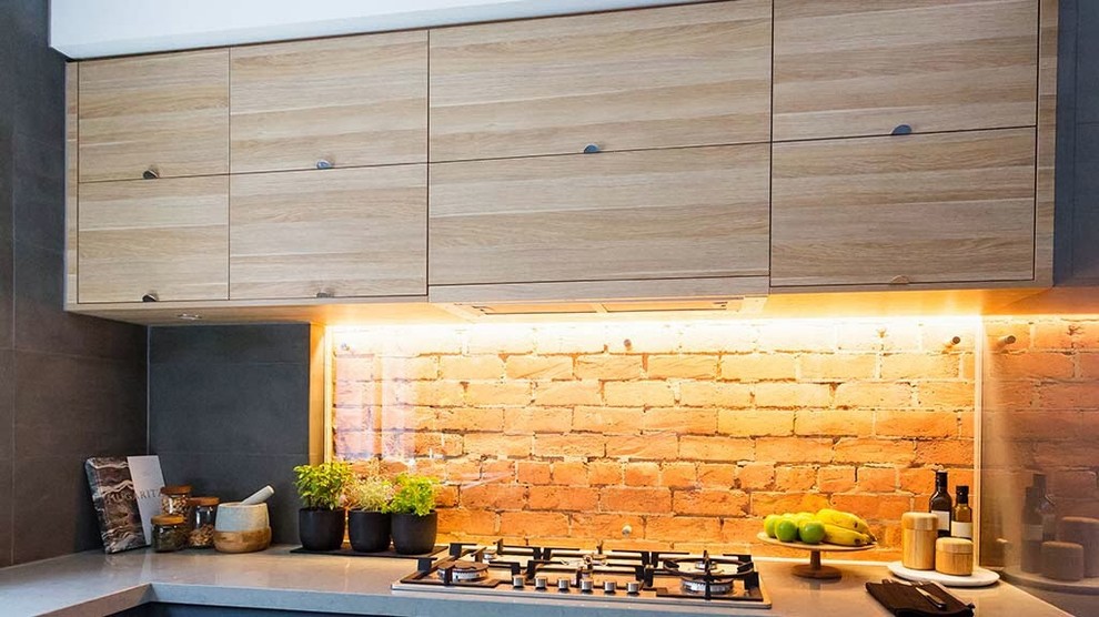 Glass over exposed brick splashbacks