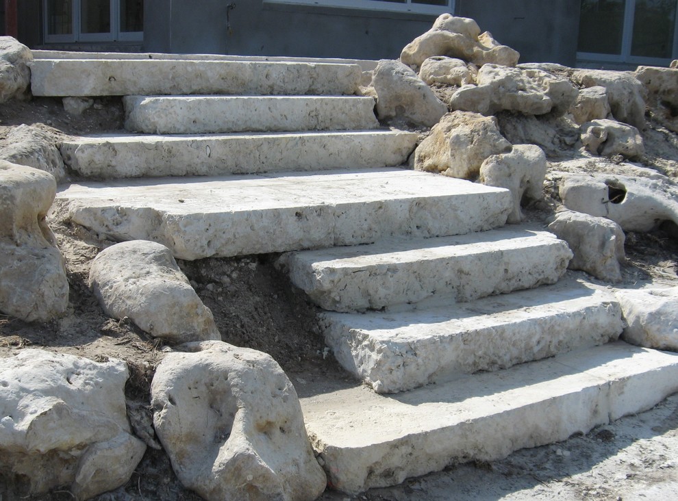 Coral steps with native Florida cap rock boulder retaining wall ...
