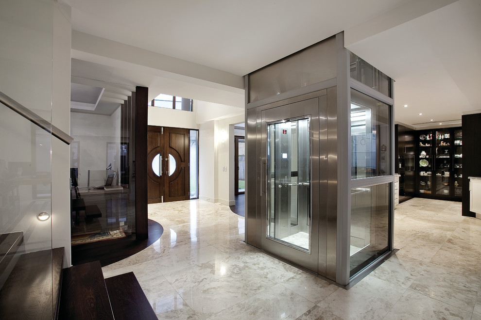 Entrance, stairs and elevator - Modern - Austin - by GreenTech Builder ...