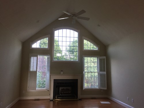 How to minimize offset windows on focal fireplace wall?