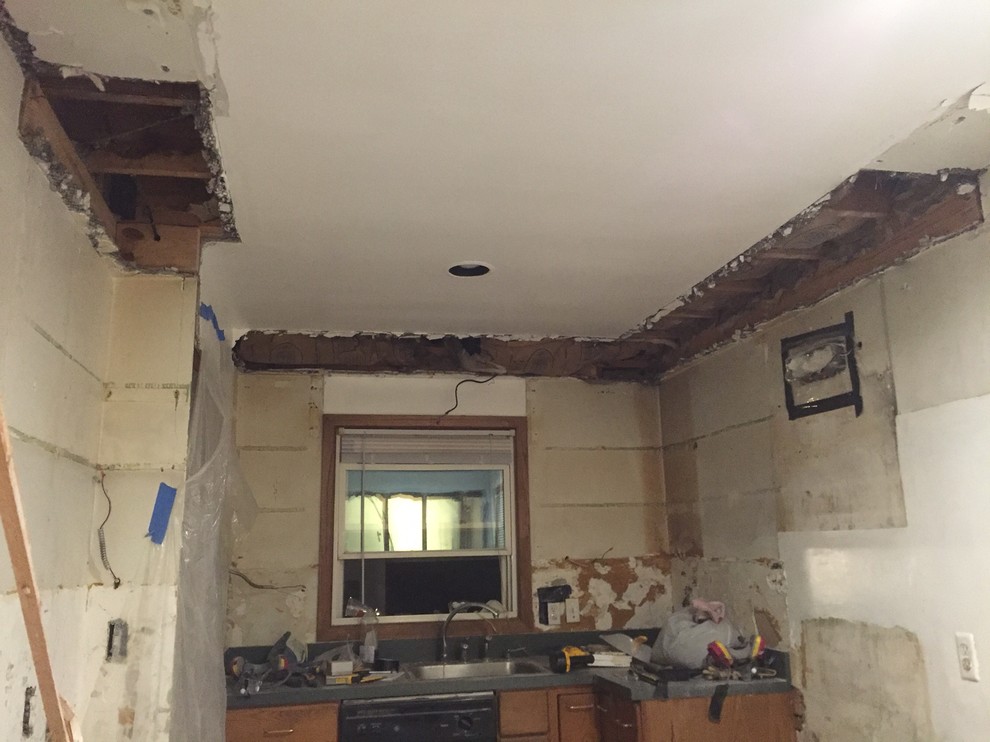 How to bond new drywall to existing plaster?