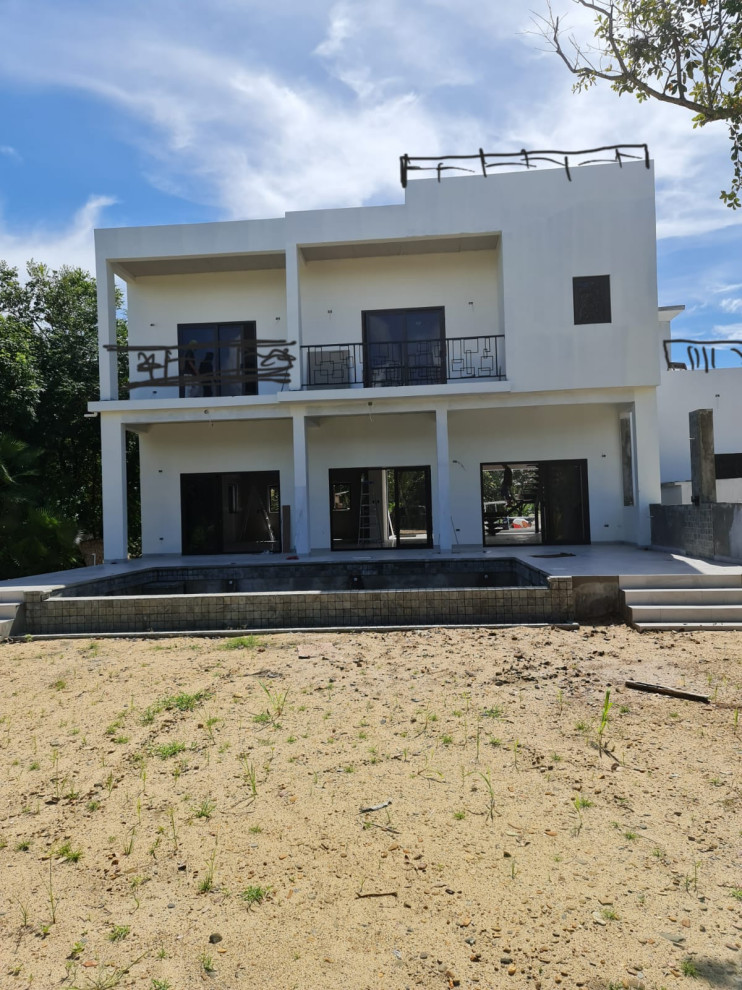 We are building a house in Belize. It is a modern, probably boxy shap