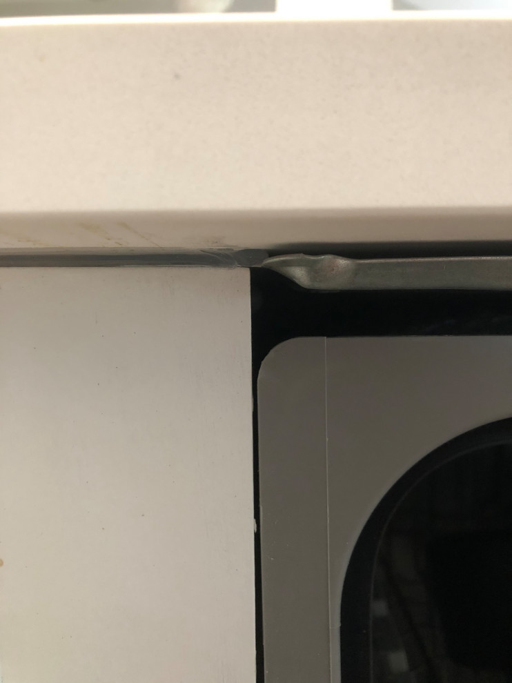 Dishwasher bracket installed between counter and cabinet?