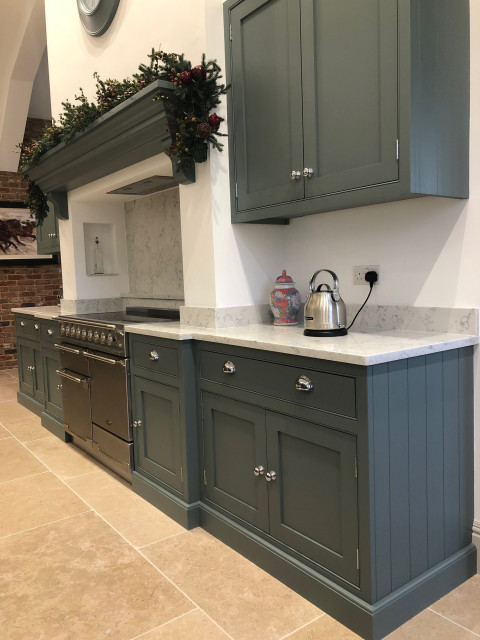 Large, green handmade kitchen with kitchen island, mantel shelf and ...