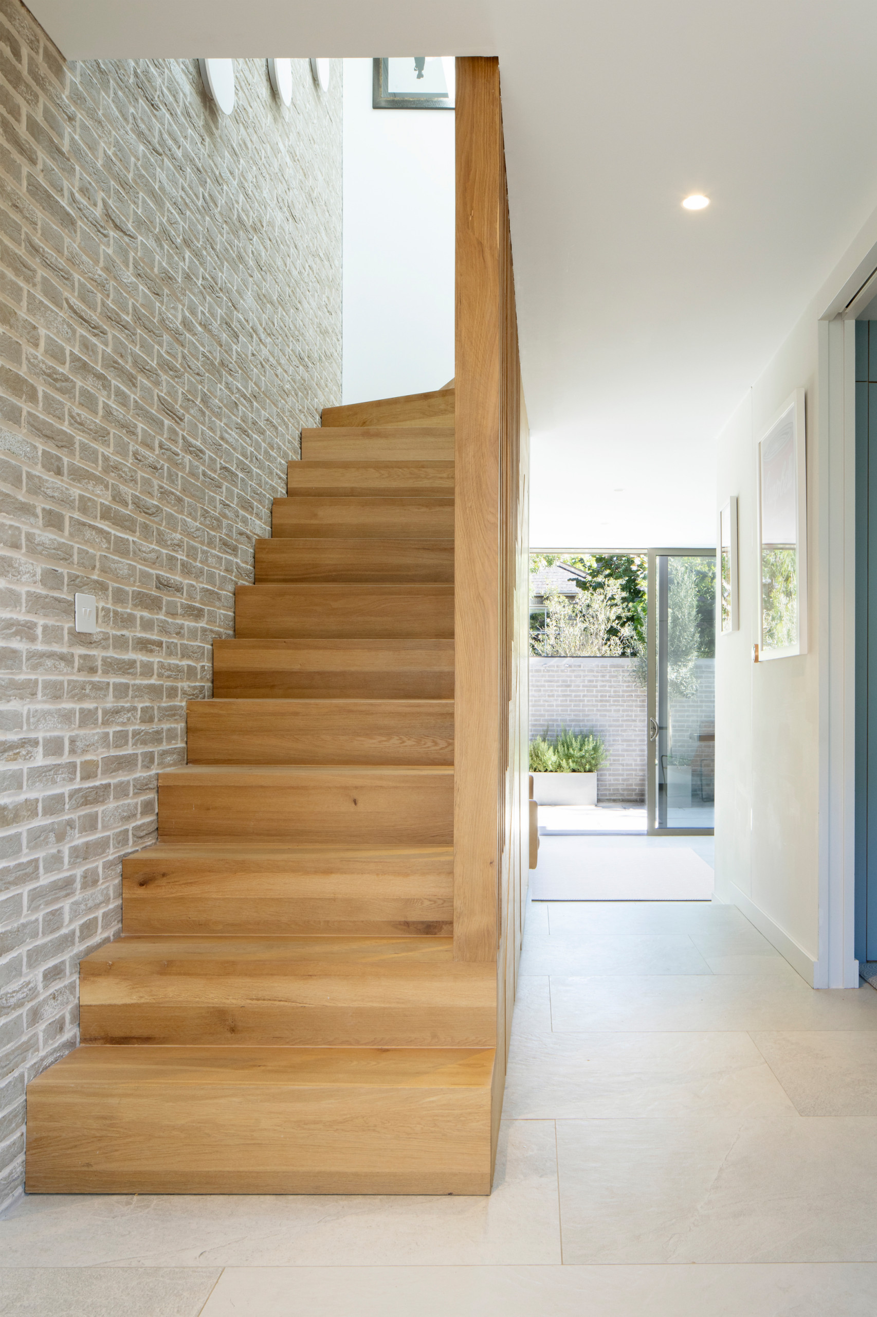 Wood Stair Risers With Brick Wall