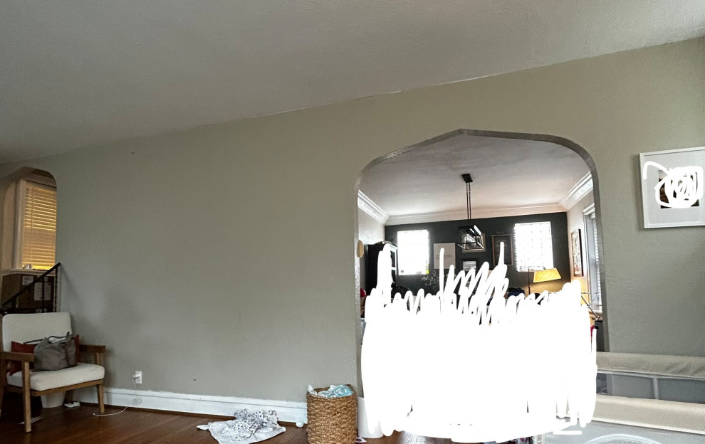 How to deal with double plaster arches in living room?