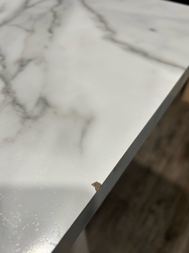 Chip in brand new laminate countertop by cabinet installer!