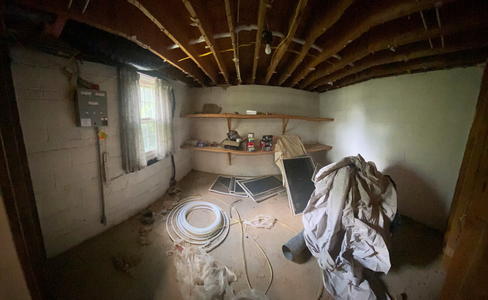 Gross basement storage room turned into office