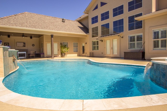 Freeform Swimming Pool with Travertine and Feature Wall - Mediterranean - Pool - New Orleans ...