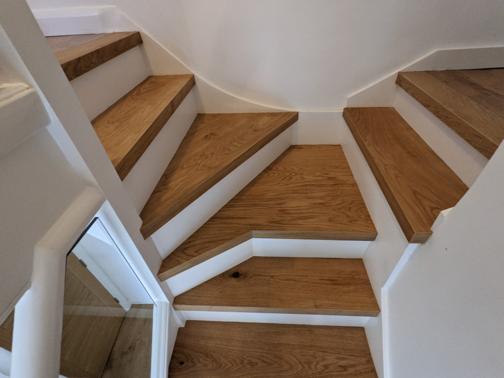 Engineered oak stair cladding with modern white painted risers, Epping ...