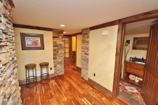 Western themed basement - Rustic - other metro - by Hendolhurst Homes Inc.