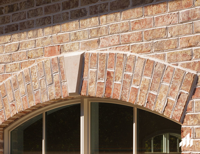 Spalding Tudor Brick Home featuring Sugarcane Brown Stone - South ...