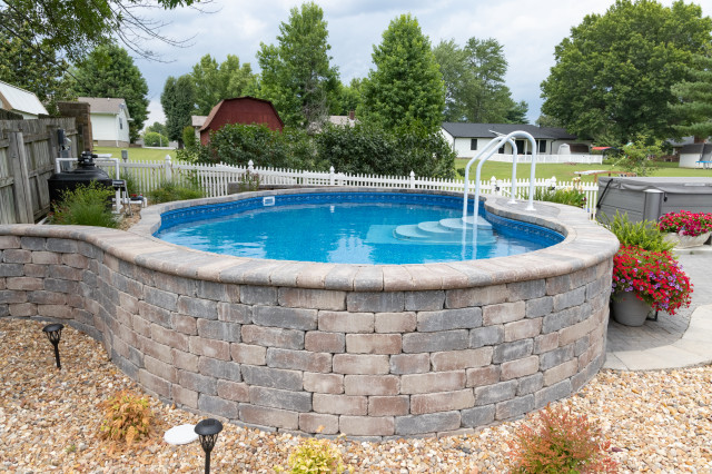 Freeform Semi-inground Stealth with stone steps and landscaping ...
