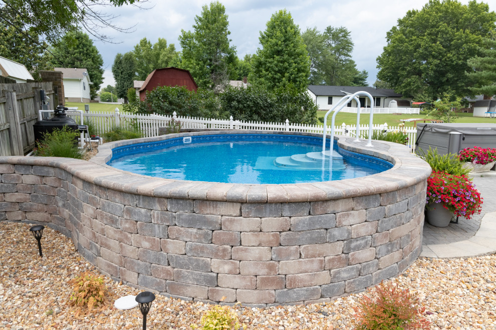 Freeform Semi-inground Stealth with stone steps and landscaping - Pool ...