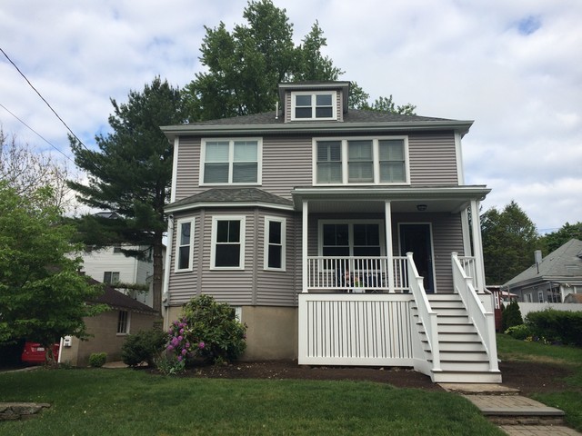 What to plant in front of tall porch?