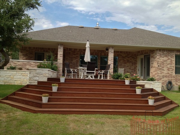Ipe Hardwood Decking with Metal Framing, Limestone Flower Beds around ...