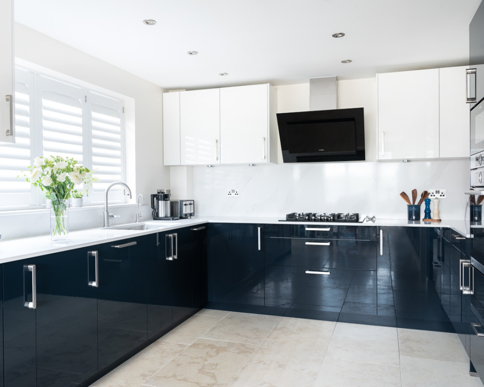 Navy and white high gloss units with Silestone Calcutta Gold worktops ...