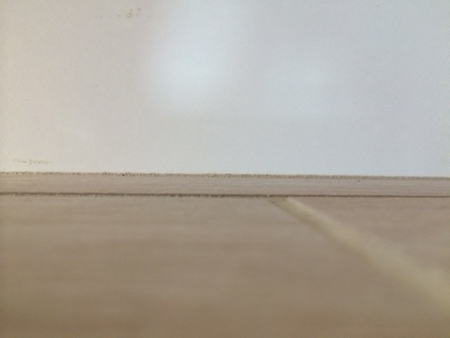 Help! Sharp edges on floor tiles after install.
