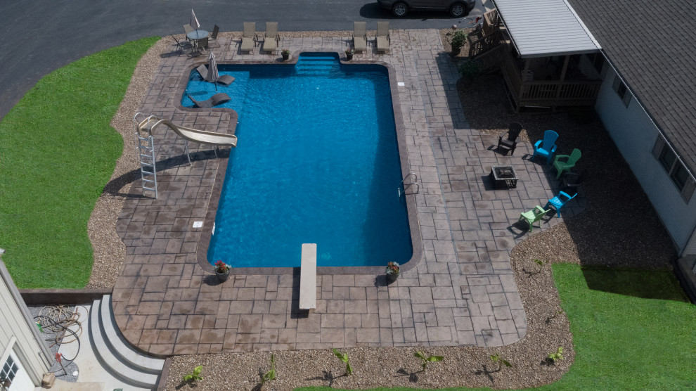 Vinyl liner pool w/tanning ledge, concrete coping and stamped concrete ...