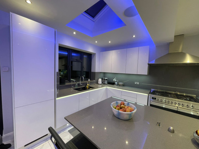 Hacker German made kitchen in white gloss handleless with channel - Modern - Kitchen - London ...