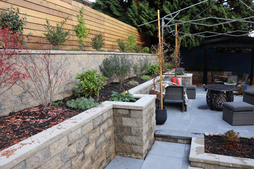 AFTER - Stepped retaining walls and cedar fence - Contemporary ...