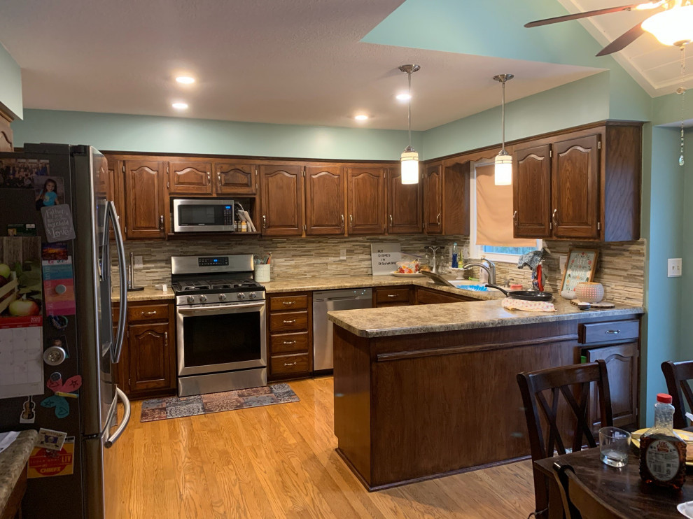 Cherry stained oak cathedral cabinets, oak floors