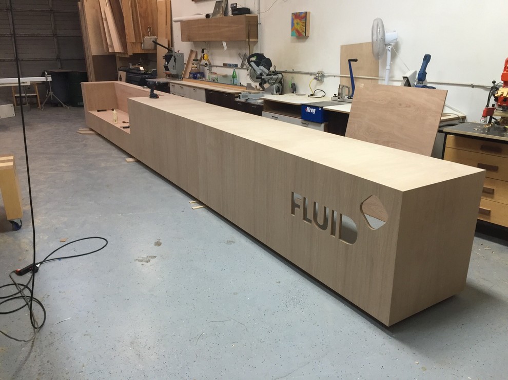25' long reception desk in sequentially matched white Oak veneers with ...