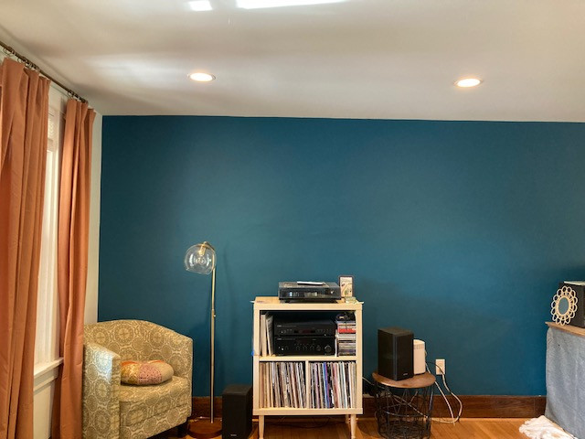 Help designing one long, windowless wall that spans two rooms?