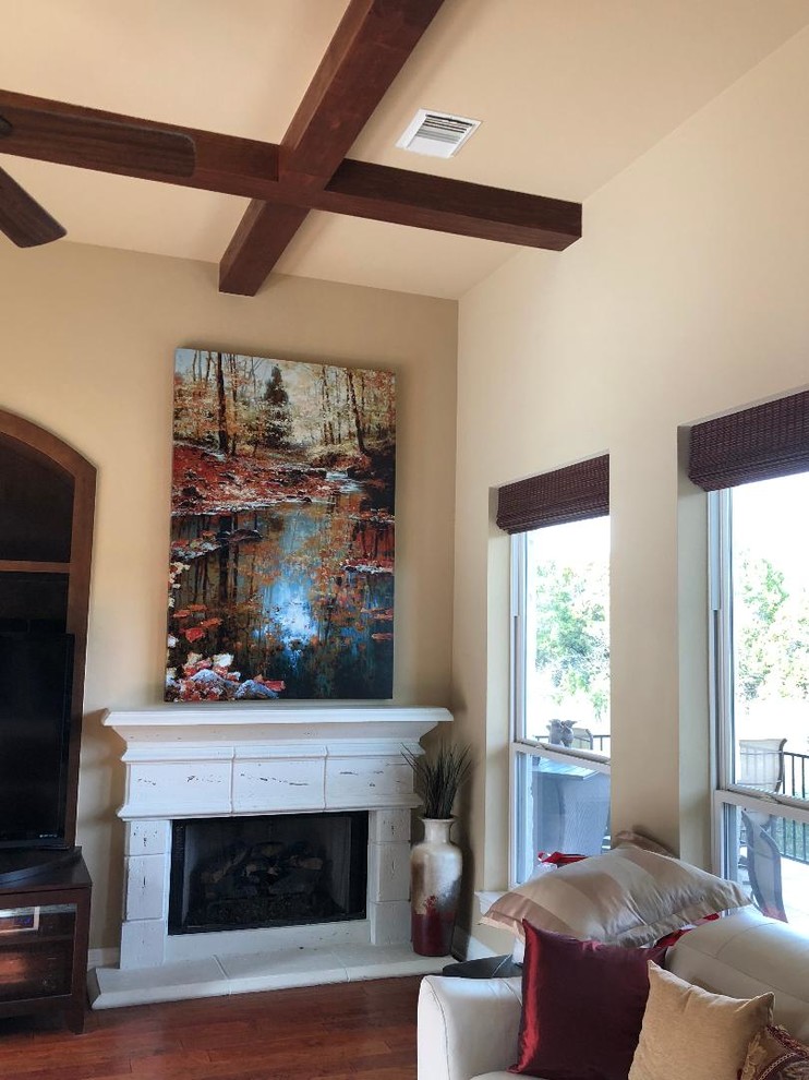 How to decorate mantle that has an extremely large painting above it