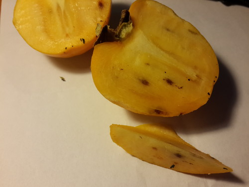 Dark spots inside and outside on persimmon fruit