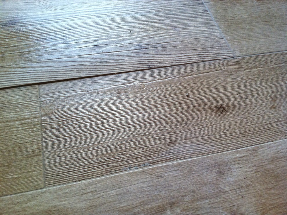 Bad tile installation or warped/bent tiles?