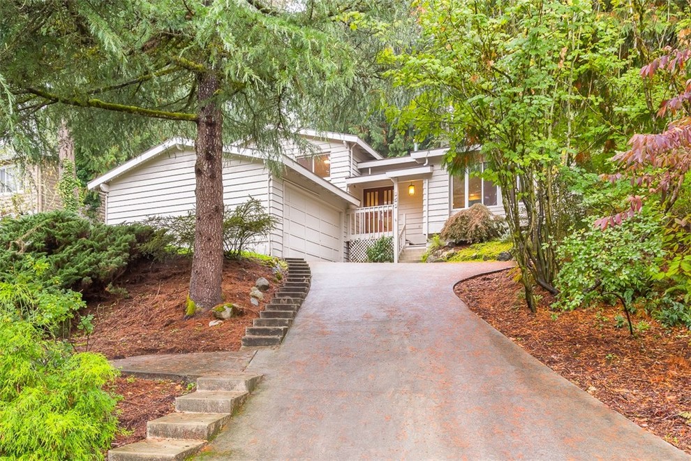 Ideas to increase appeal of a plain garage side wall at front of home?