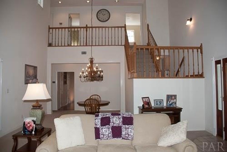 Boxy stairs in 90s great room