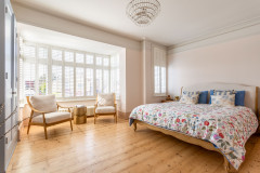 Room Tour: A Large Bedroom Suite Gains Storage and Distinct Zones ...