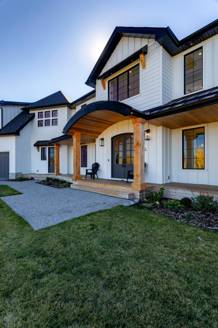A covered wood soffit Veranda - Country - House Exterior - Calgary - by ...