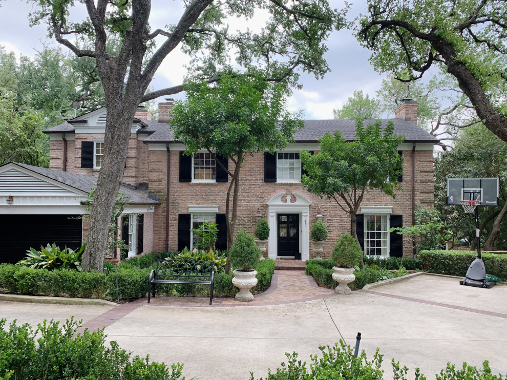 Traditional Brick Classic Home with White Trim and Black Shutters ...