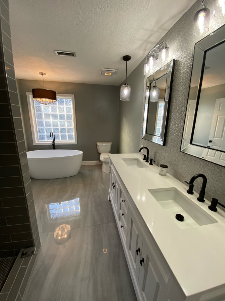 Large gray polished ceramic tile in the Master bathroom