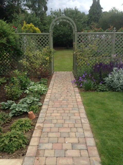 Long garden with trellis divider and rose arch - Traditional - Garden ...