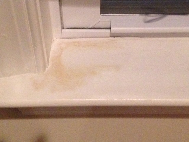 House 1 yr old and inside window sill showing water damage
