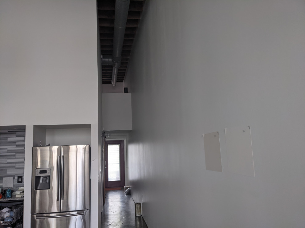Visually separating large hallway wall