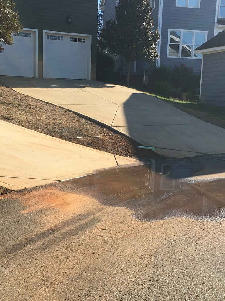 Water pounding at bottom of yard at road